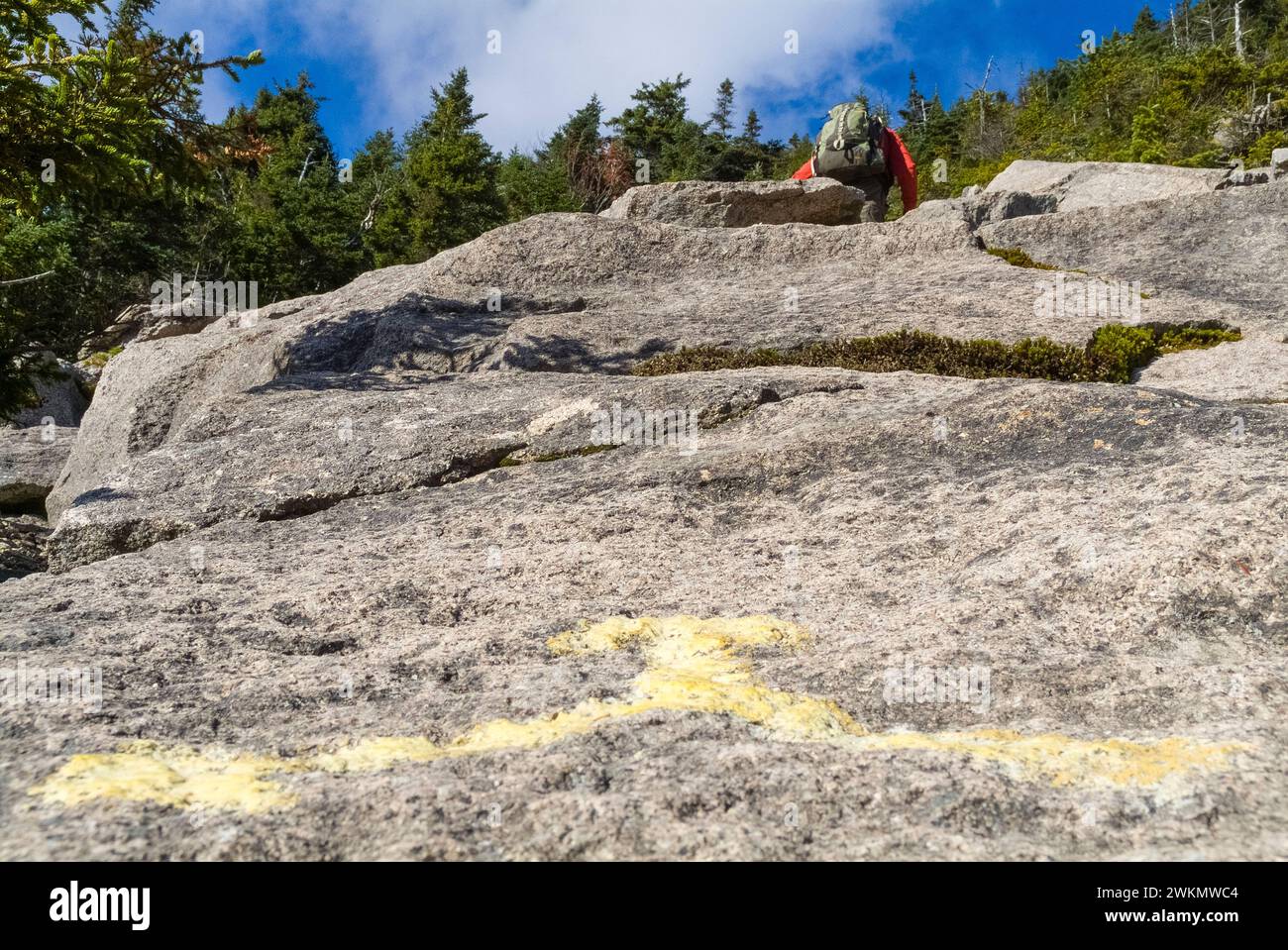 A hiker ascending South Slide, which is located along the Mt ...