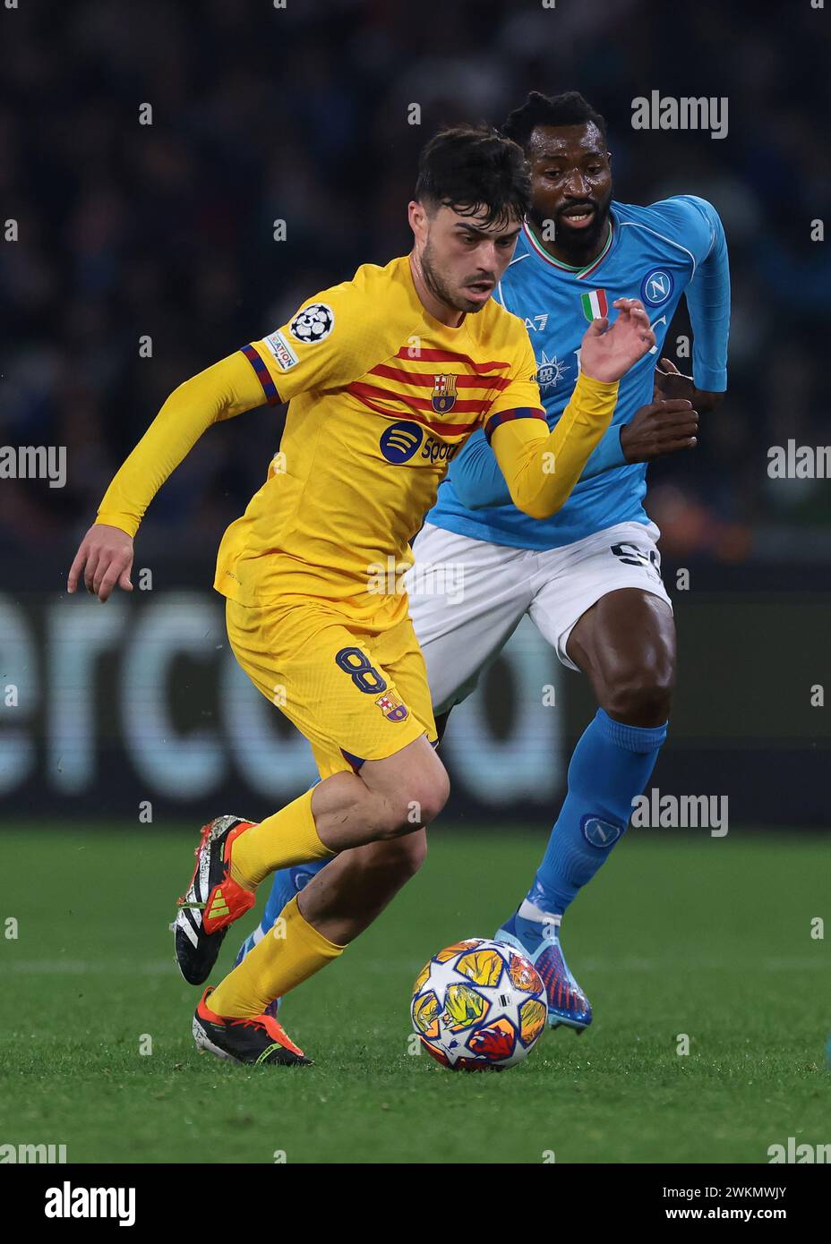 Naples, Italy. 21st Feb, 2024. Pedro of FC Barcelona is pursued by ...