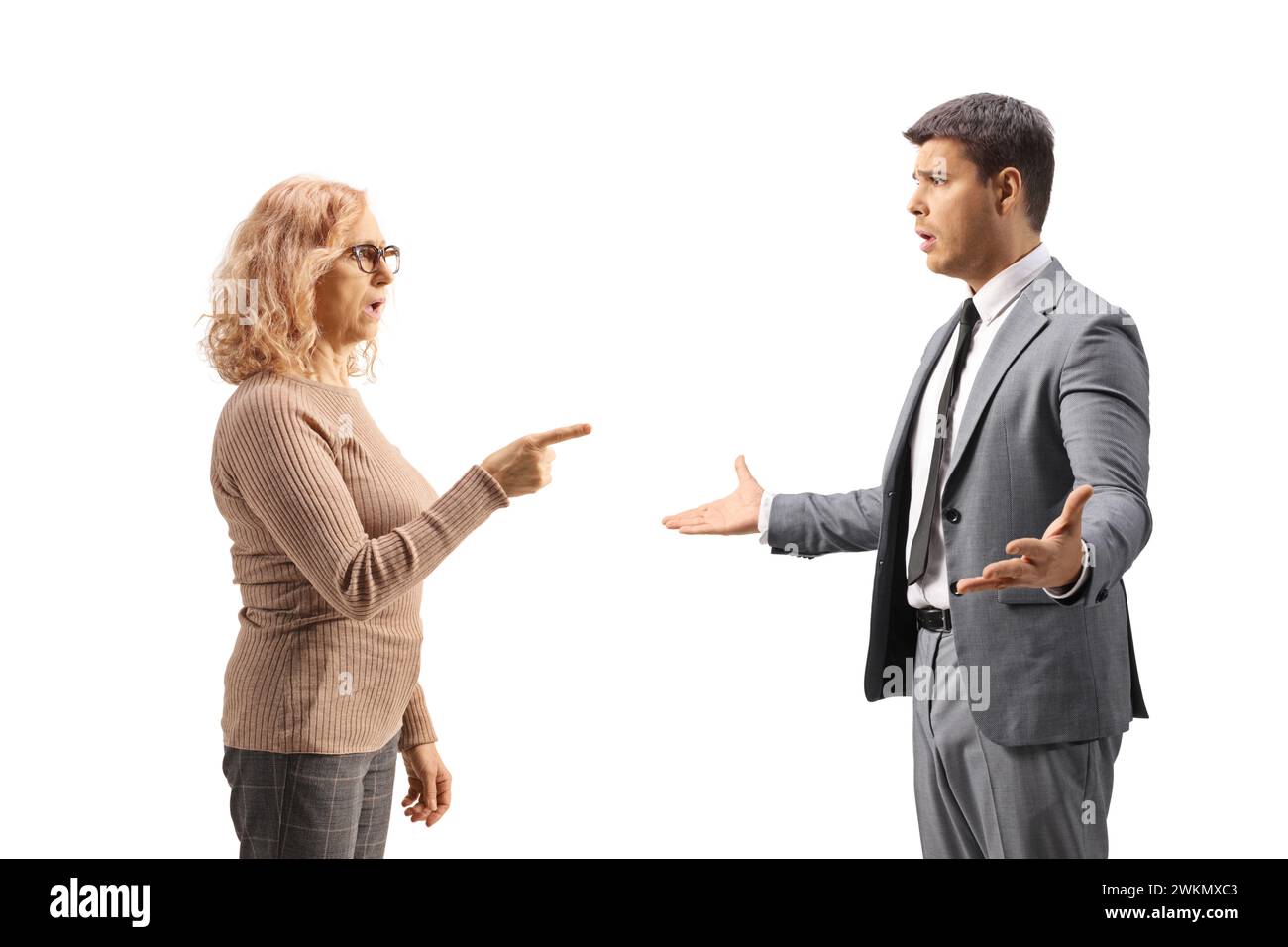 Young businessmen having an argument with a mature woman isolated on ...