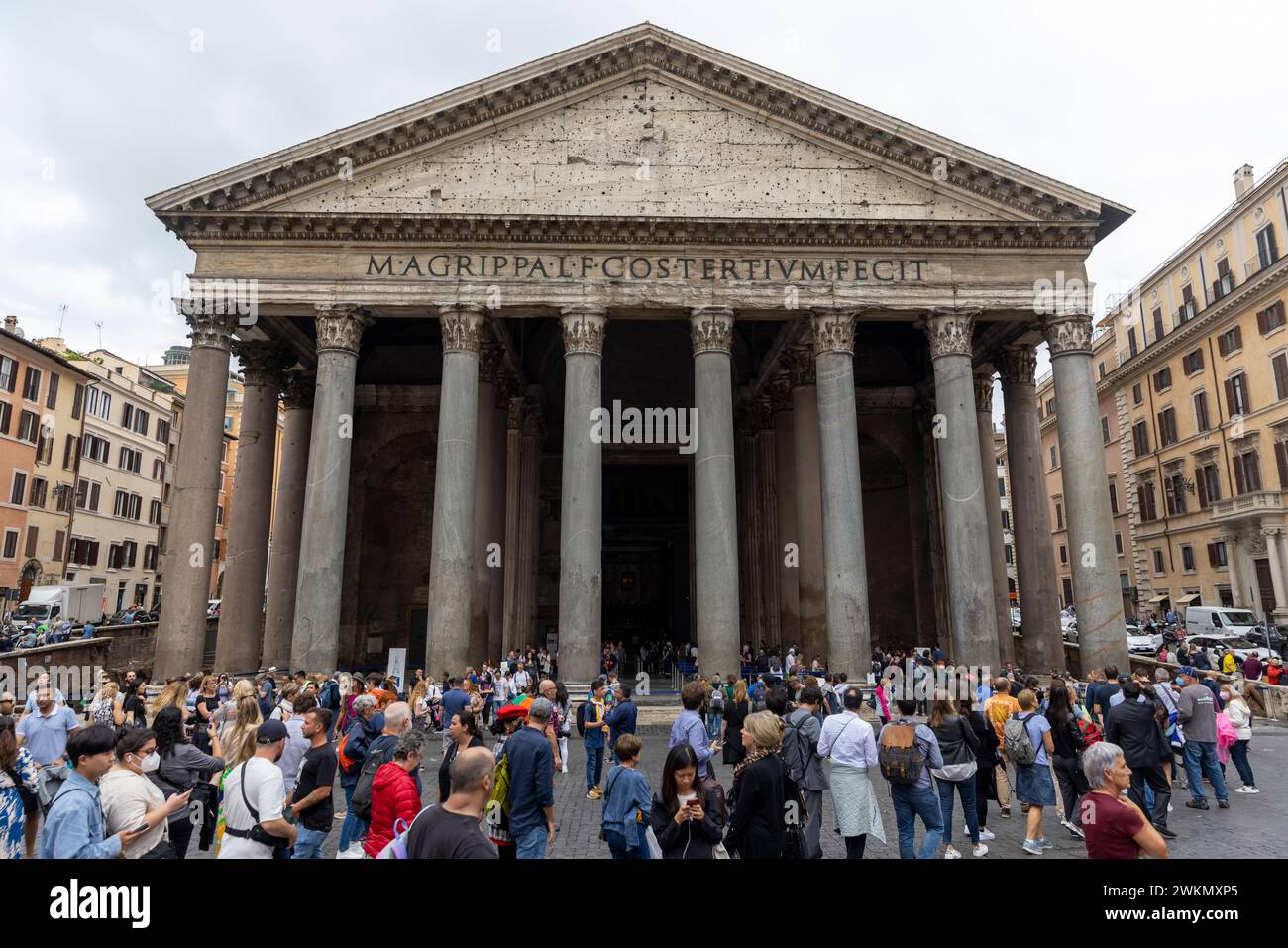 Visitors line up in Piazza della Rotunda to enter The Pantheon in Rome ...