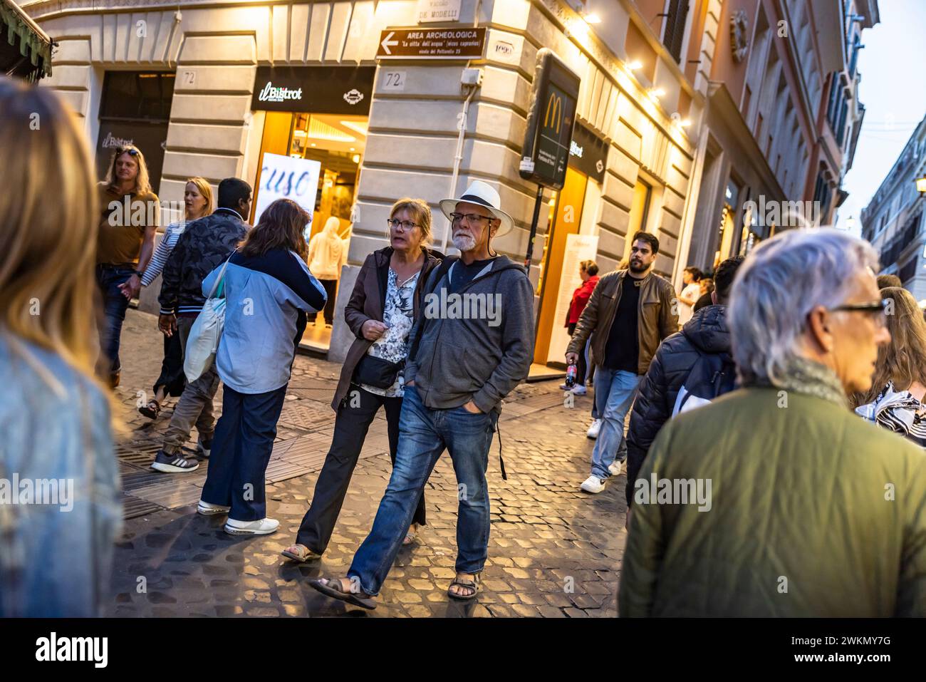 A street scene in Rome where travelers weave their way through narrow ...