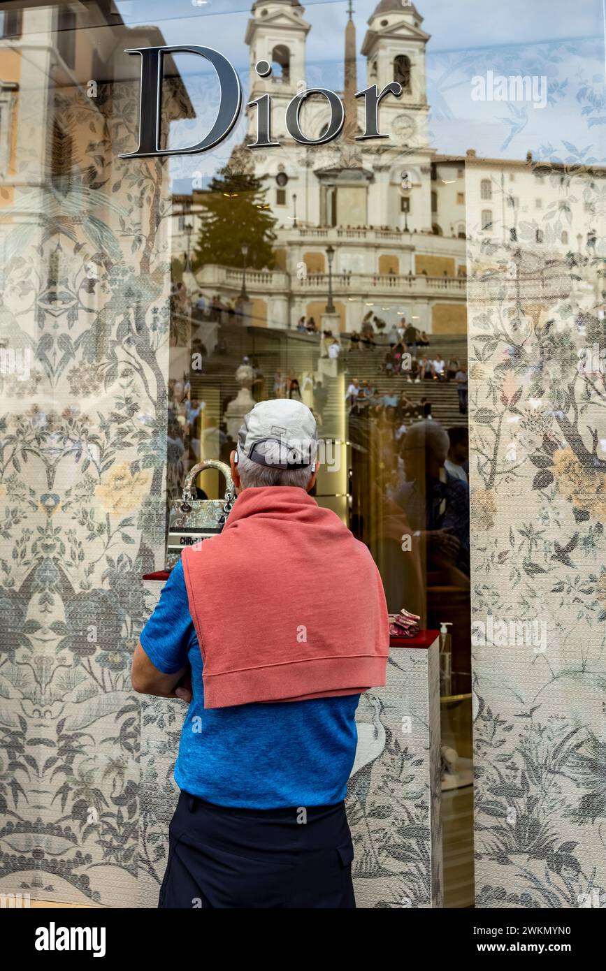 The Spanish Steps in Rome are reflected in the window of Dior Stock ...