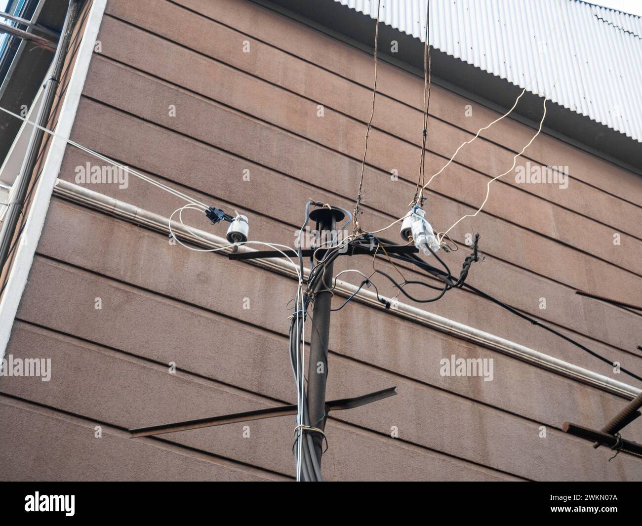 Homemade power pole made of metal. Wires on a pole. Electricity on the ...