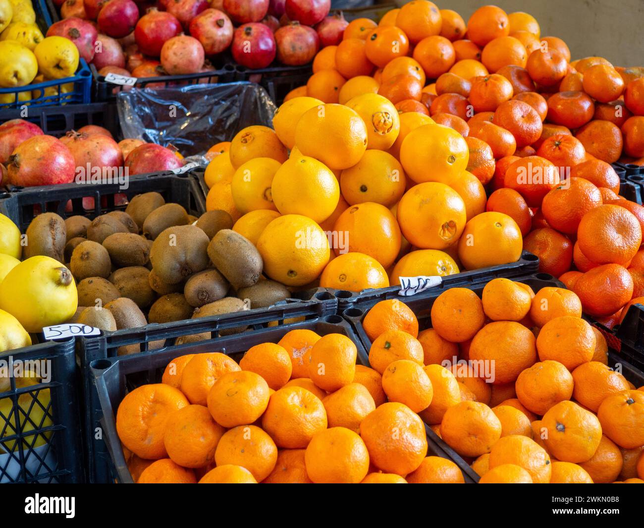 Fruits at the eastern market. Fruits in boxes for sale. The atmosphere ...