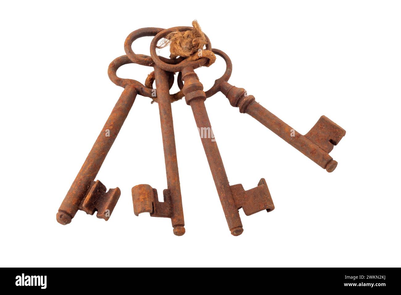 Rusty old keys. Four old keys tied with string. Vintage bunch of keys ...