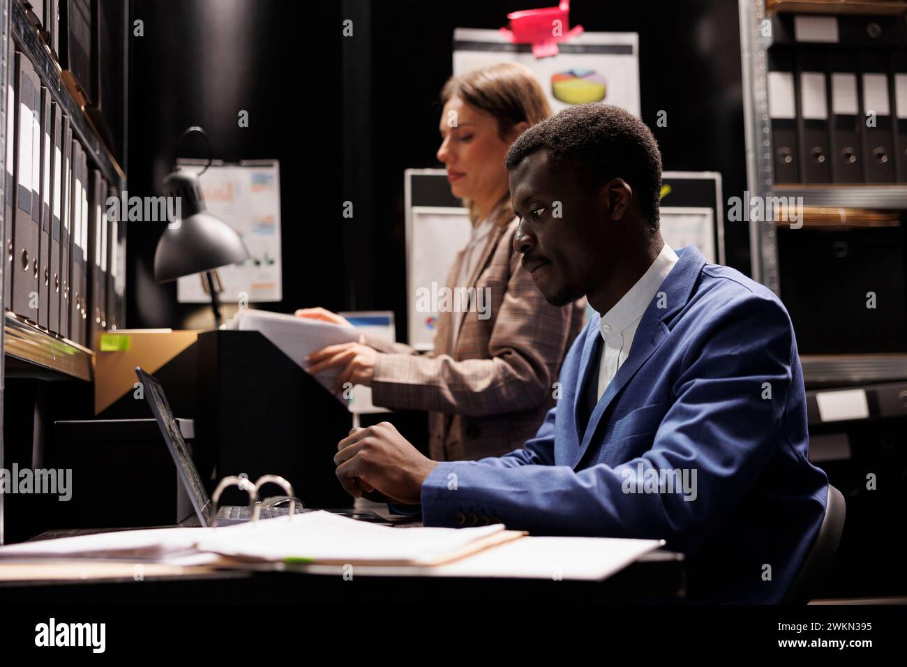 Private detectives reading criminology report, discussing crime scene ...