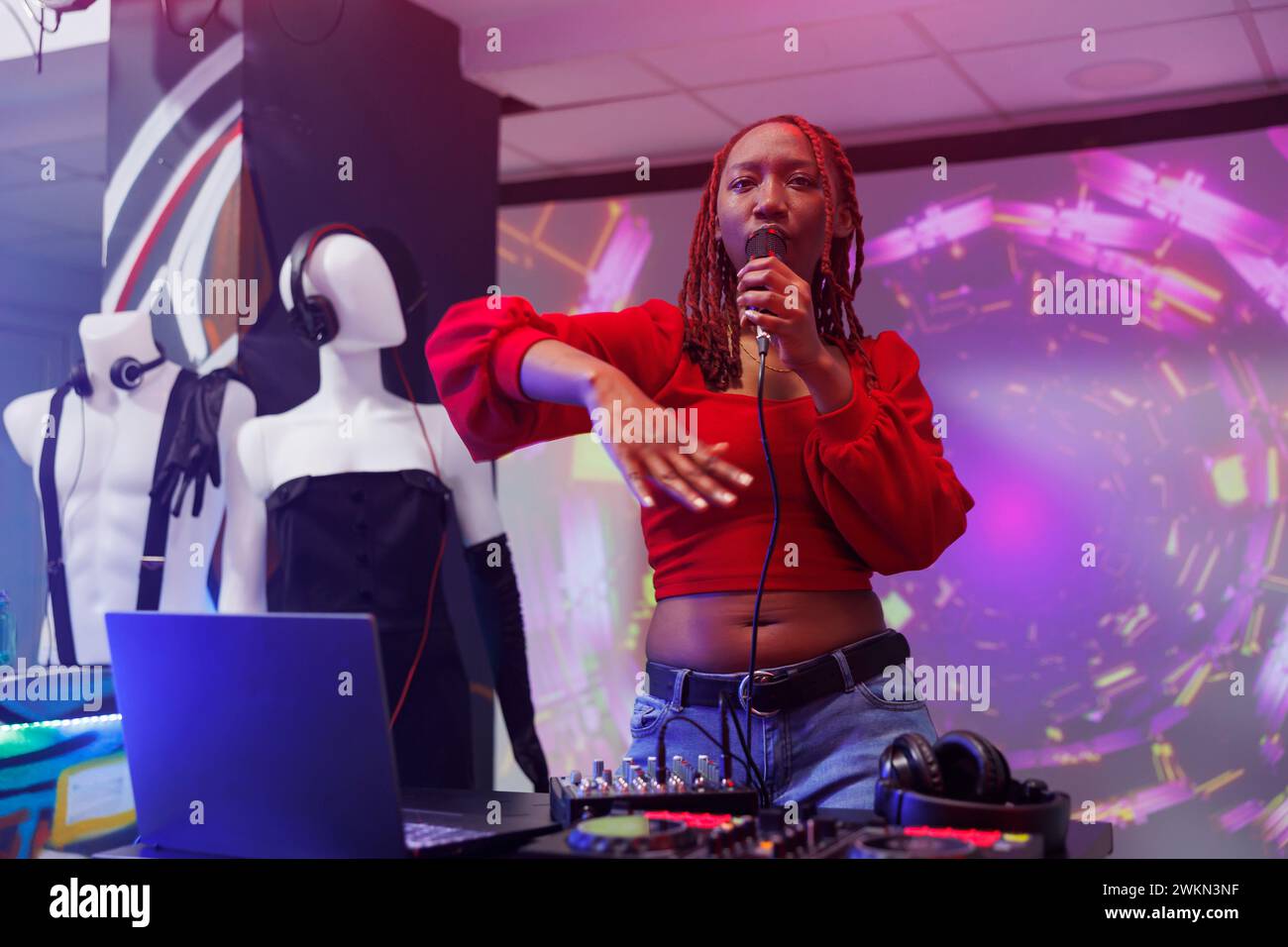 African american singer performing on stage at nightclub party. Woman ...