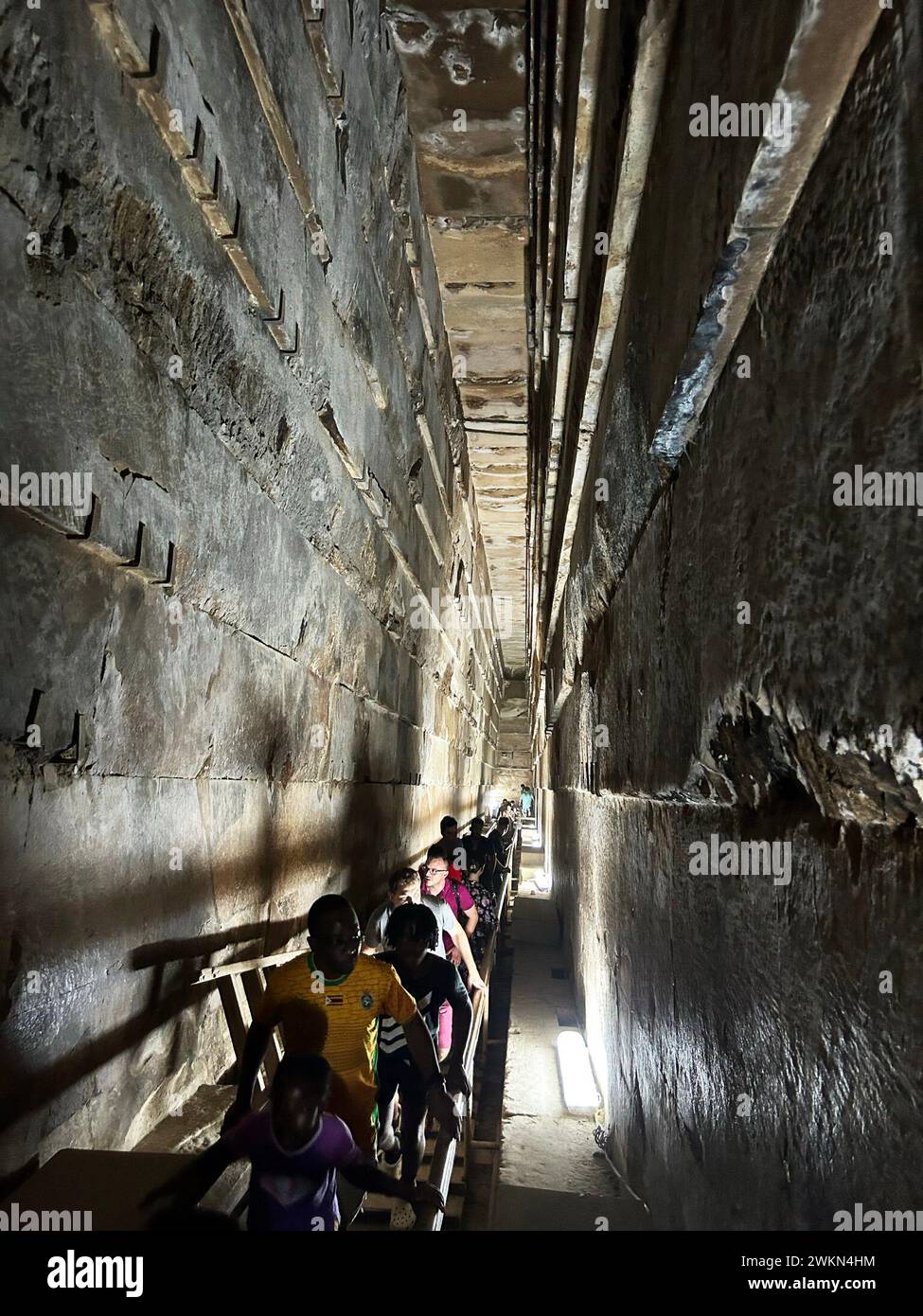 Cairo, Egypt. 24th Mar, 2023. Tourists delve deep inside the Great ...
