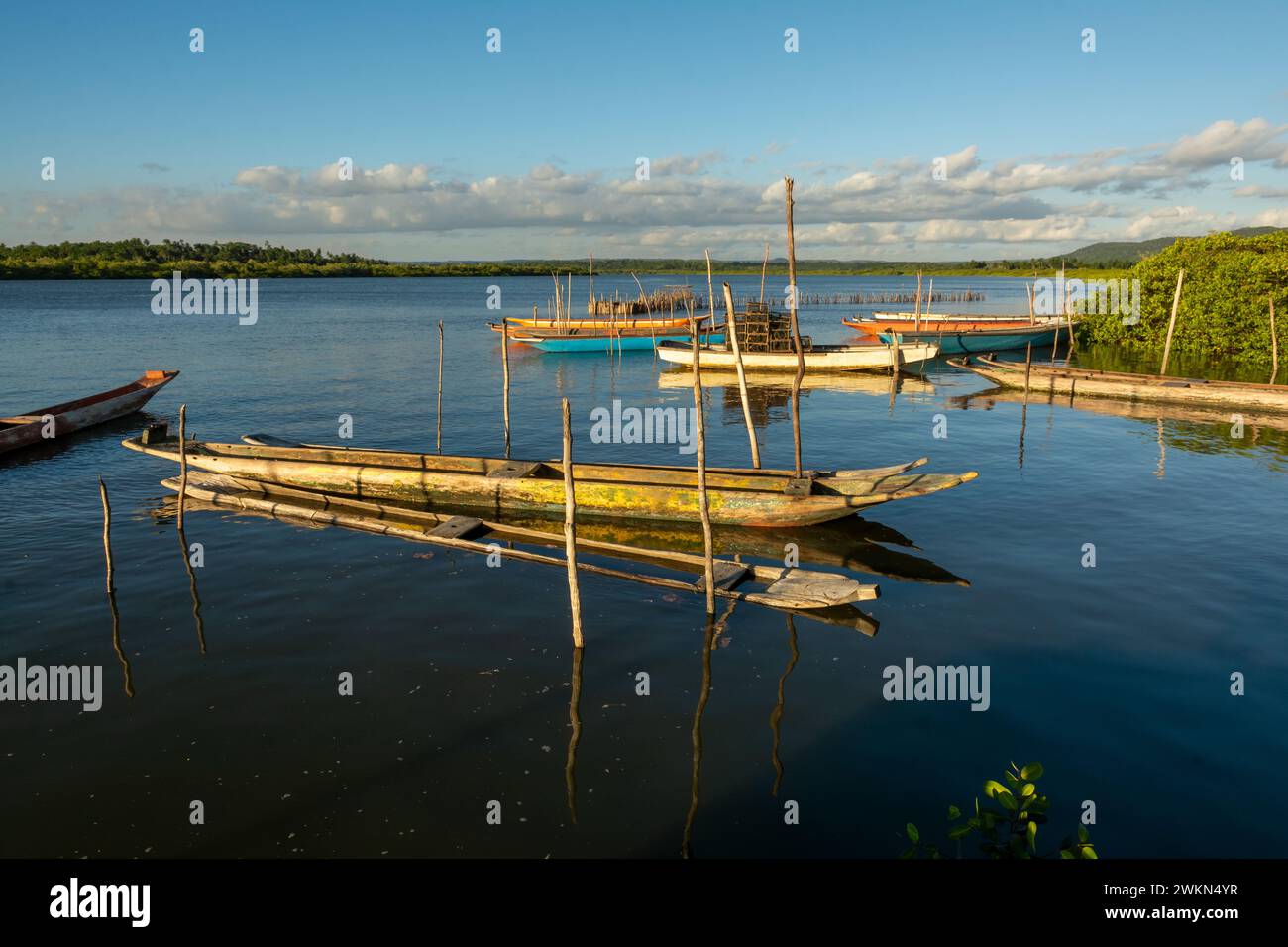 Canoes docked on a mighty river. Santiago do Iguape, Bahia Stock Photo ...