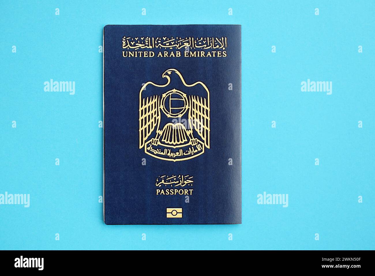 Blue United Arab Emirates passport on blue background close up. Tourism ...