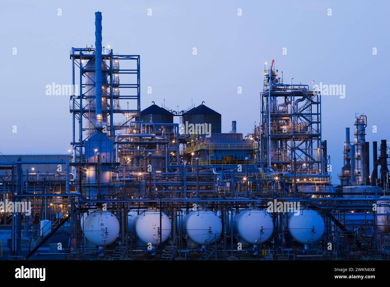 Oil and gas refinery illuminated at dusk, Montreal East, Quebec, Canada ...