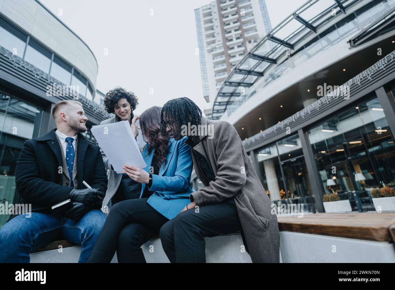Reviewing document diverse coworkers hi-res stock photography and ...