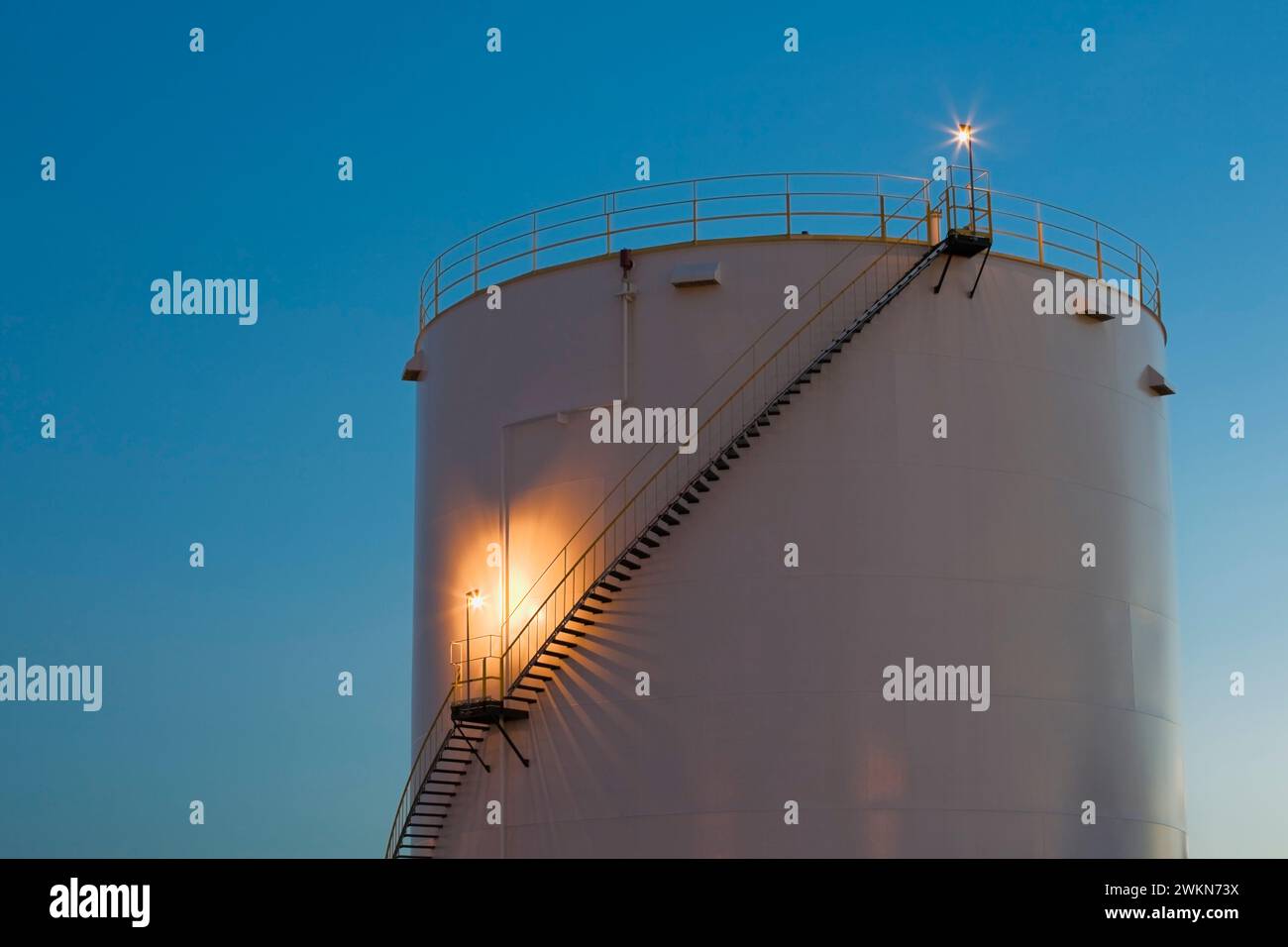 Storage tank at an oil and gas refinery at dusk, Montreal East, Quebec ...
