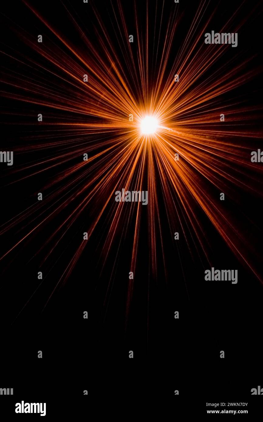 Orange and white fireworks burst sun effect against black sky ...