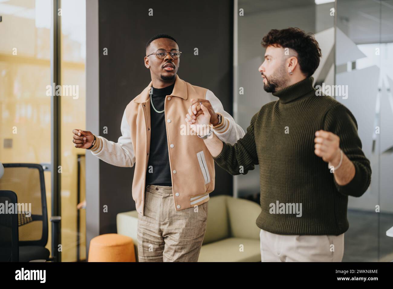 Work break joy. Diverse colleagues share positive energy, dancing the ...