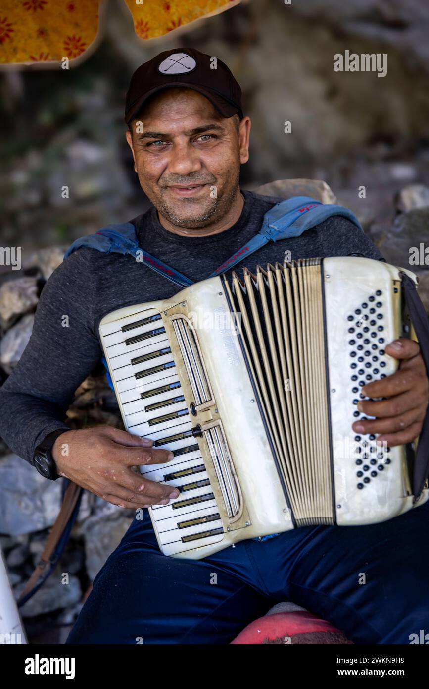 A man plays the accordion in Cinque Terre along centuries old goat path ...