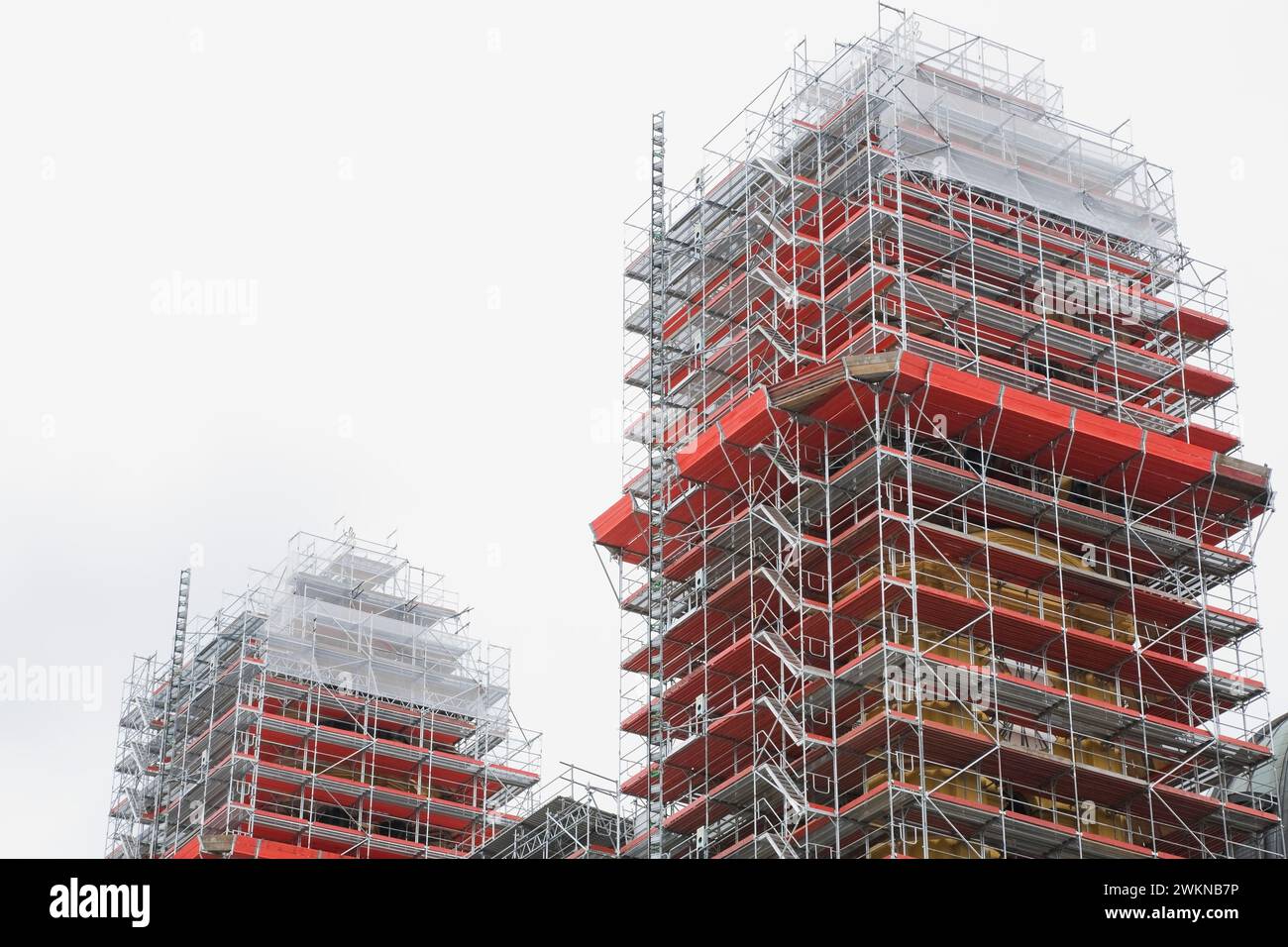 Buildings with scaffolding undergoing construction and renovation work ...