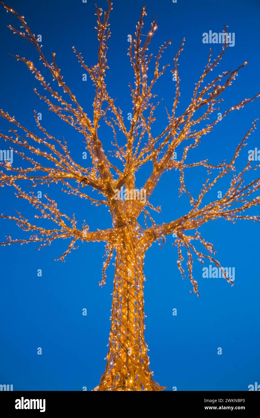 Illuminated non-traditional Christmas tree structure at dusk, Old ...