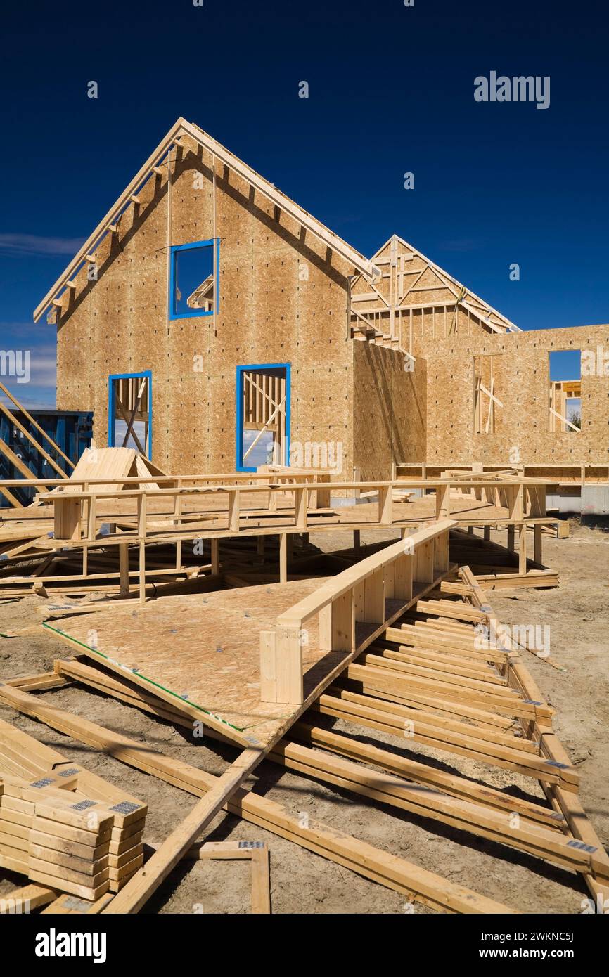 Two story wood frame home under construction Stock Photo - Alamy