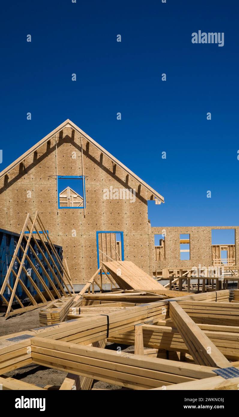Two story wood frame home under construction Stock Photo - Alamy