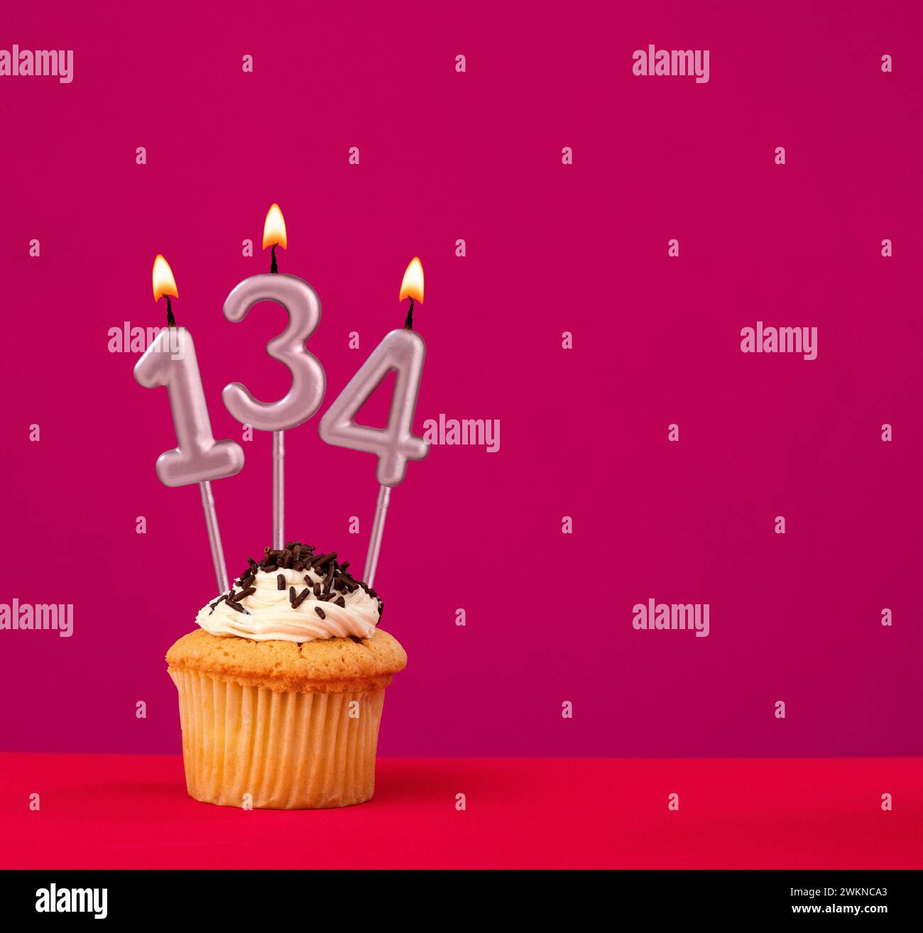 Candle number 134 - cupcake birthday in rhodamine red background Stock ...