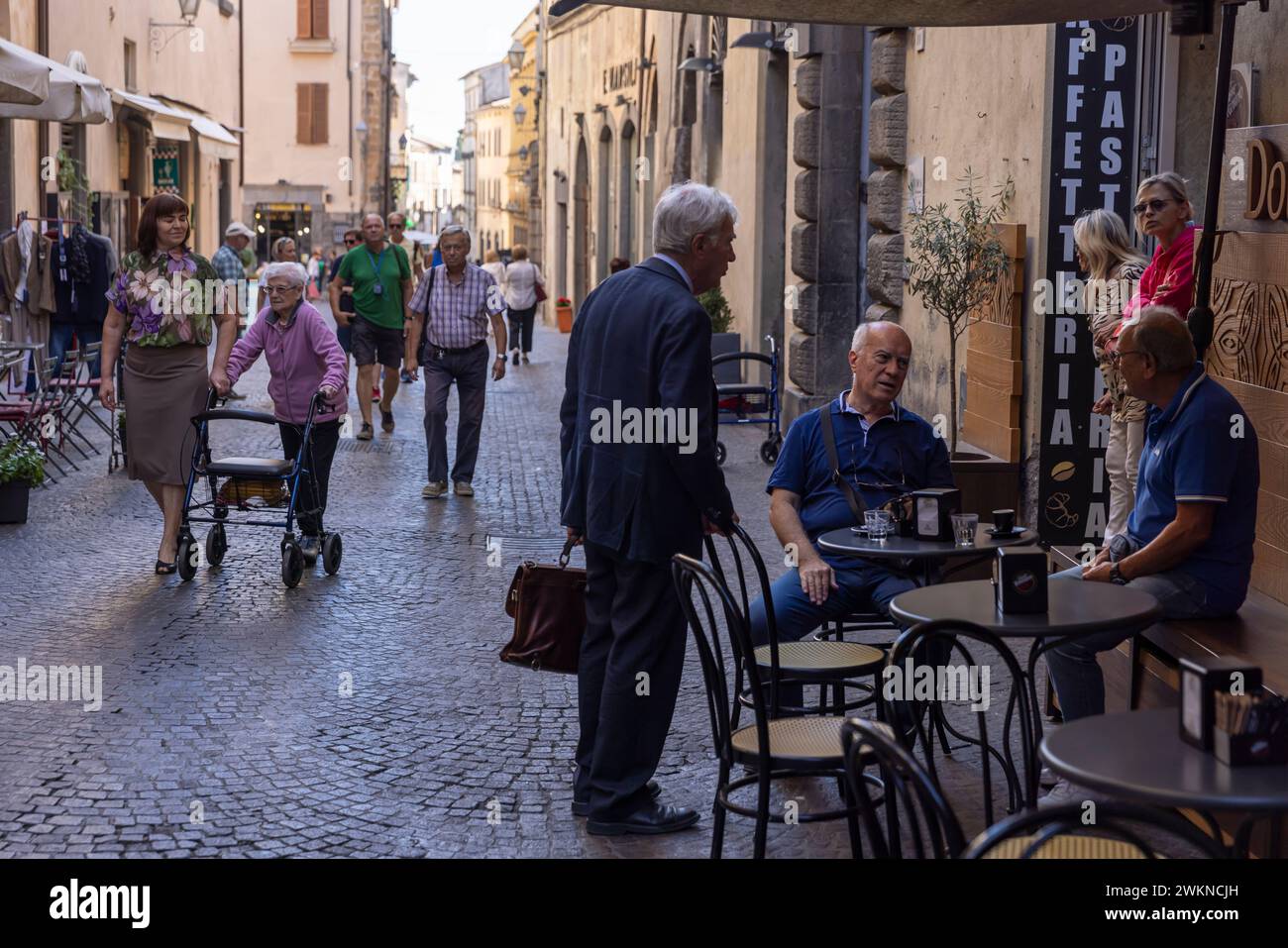 Friends visiting in the street in Orvieto, Italy Stock Photo - Alamy