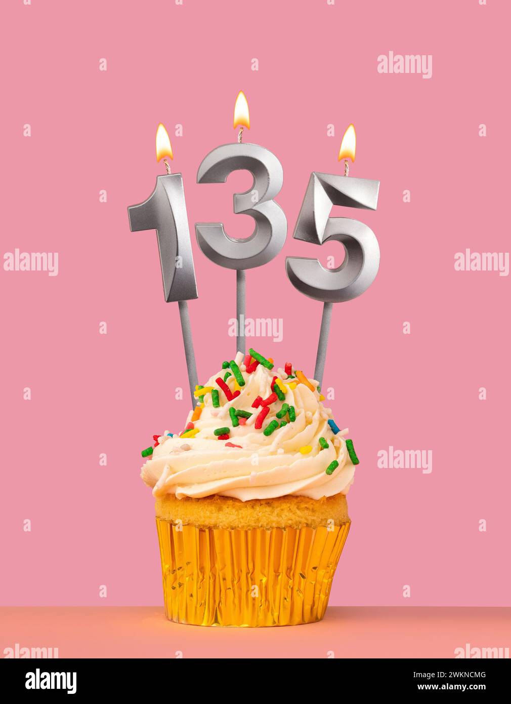 Birthday card with cupcake and candle number 135 Stock Photo - Alamy