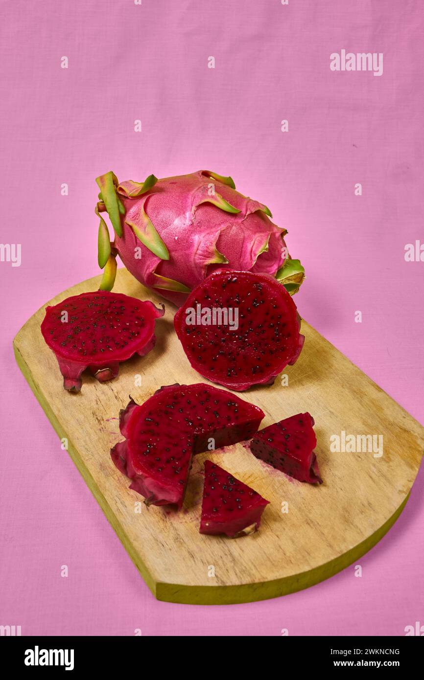 Red dragon fruit Set with appetizing serving Isolated on pink ...