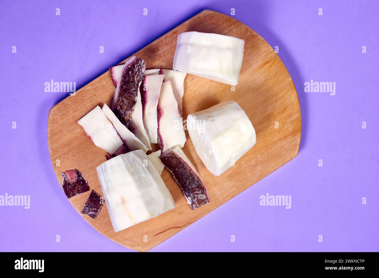 Fresh Organic Cassava Root, Manioc Esculenta, yuca On purple Background ...