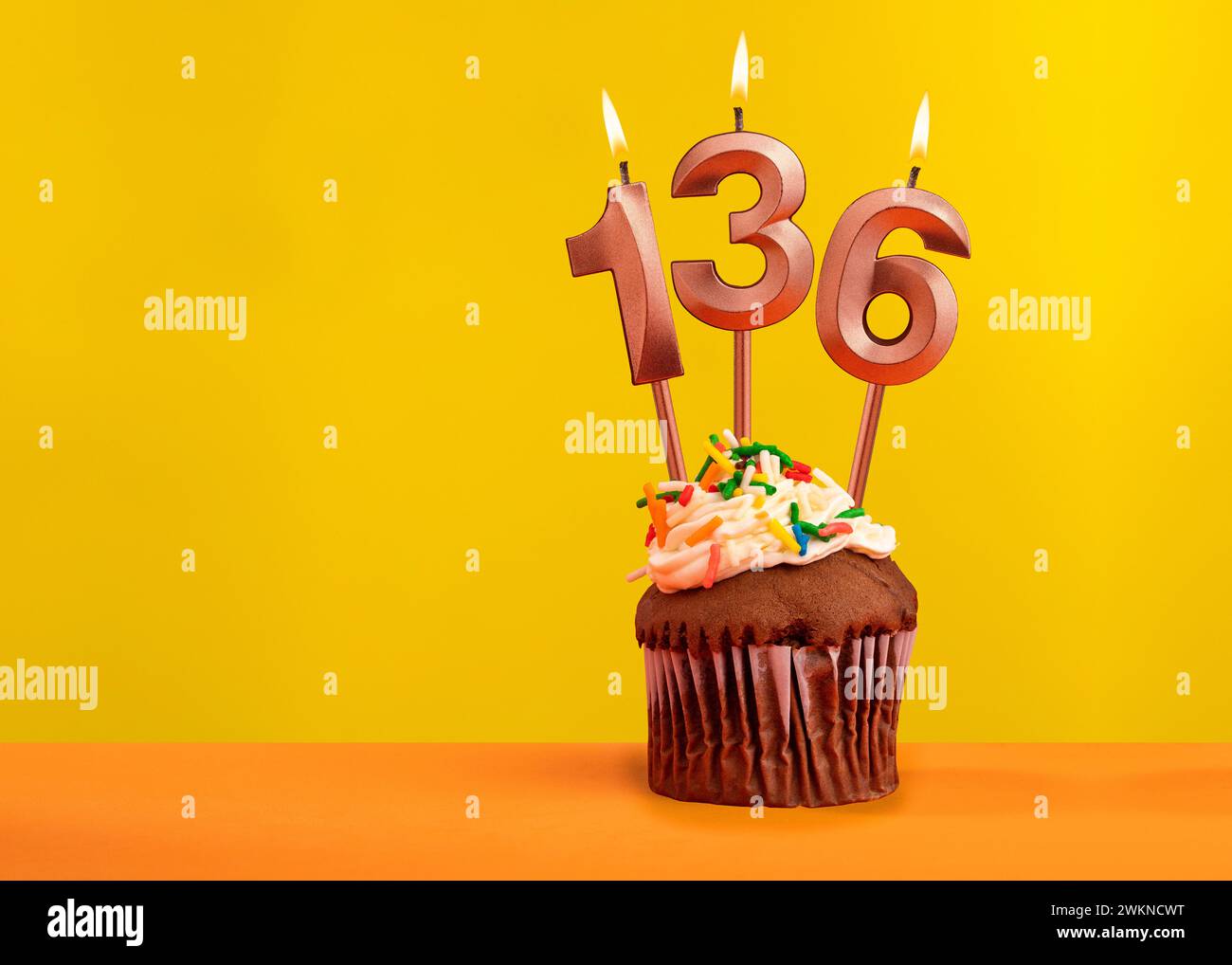 Number 136 birthday candle - Celebration on yellow background Stock ...