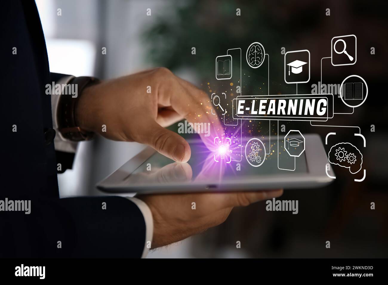 E-learning. Man using tablet on blurred background, closeup ...