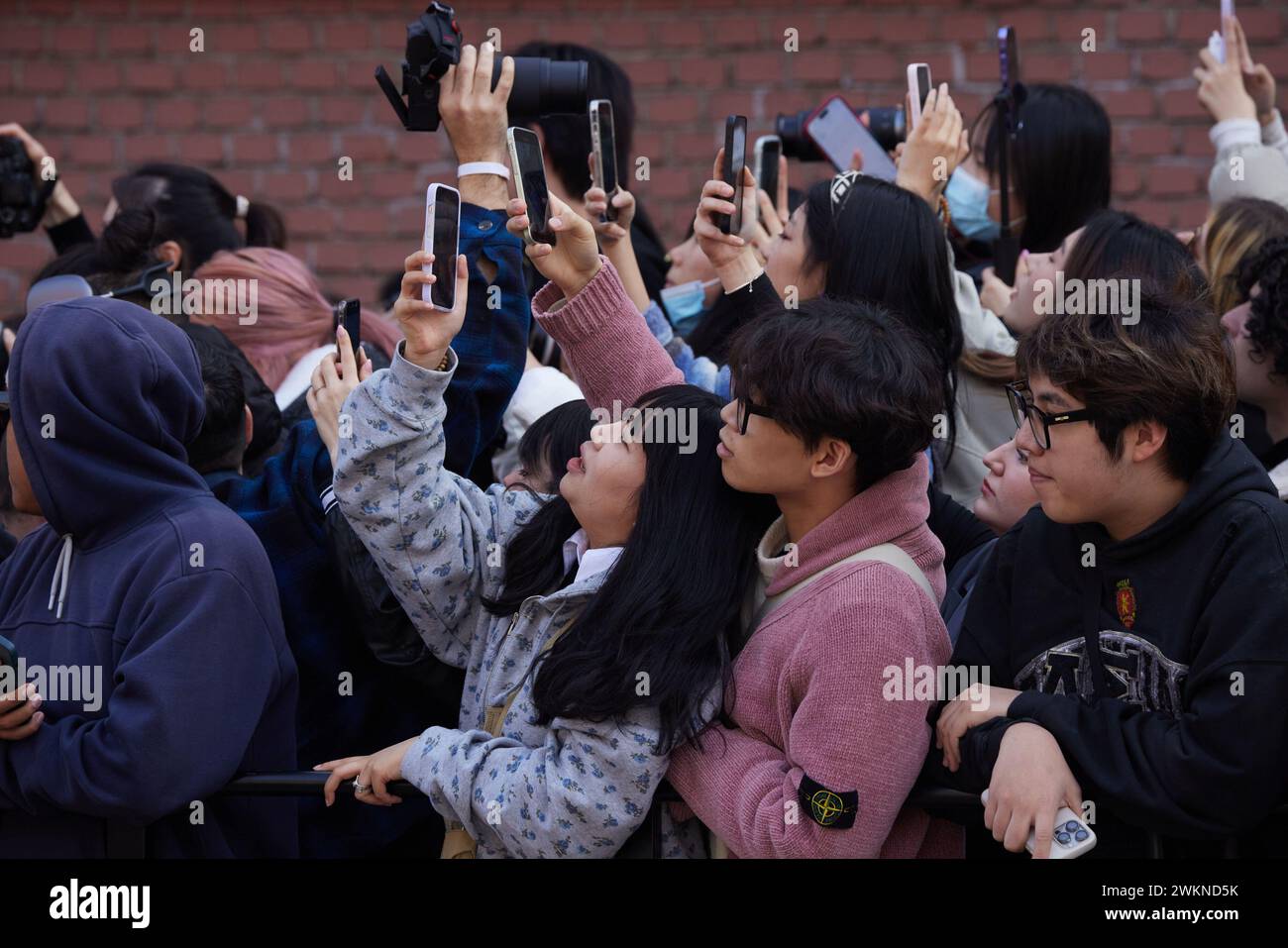 Crowd with cell phone is seen outside the Fendi fashion show during ...