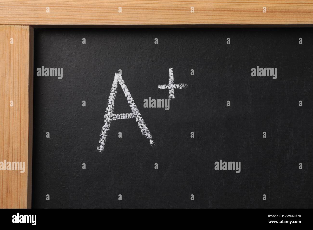 School grade. Letter A with plus symbol on blackboard, top view Stock ...
