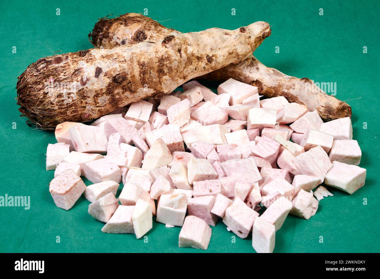 closeup of taro root vegetable, eddo malanga, hands table slice Stock ...