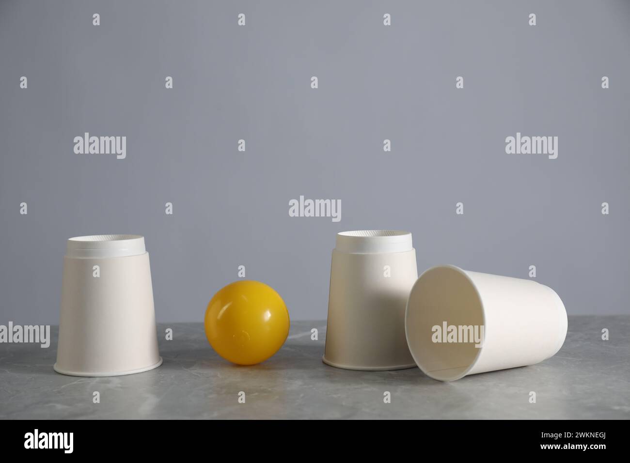 Three cups magic trick hi-res stock photography and images - Alamy