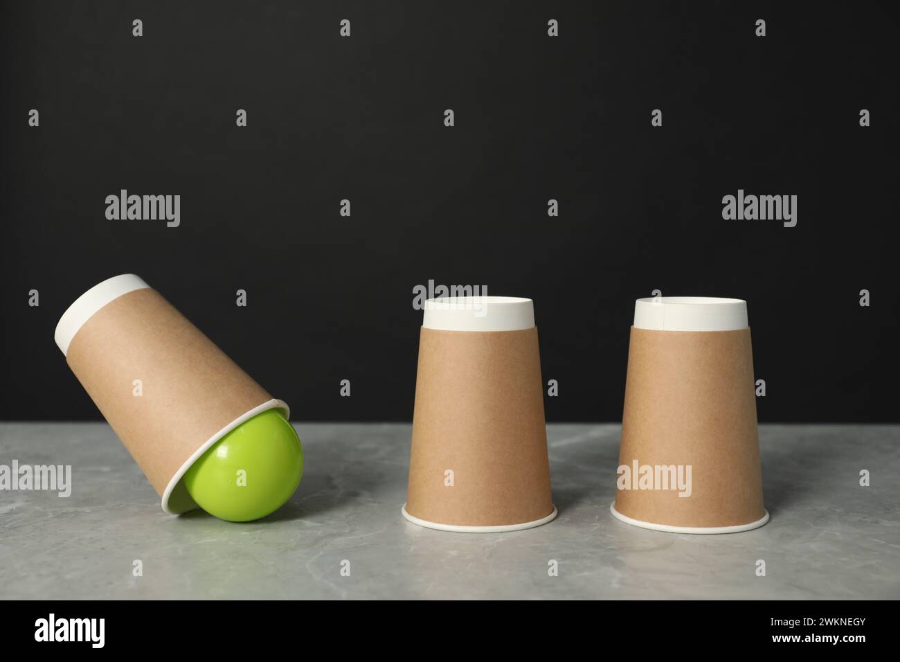 Three cups magic trick hi-res stock photography and images - Alamy