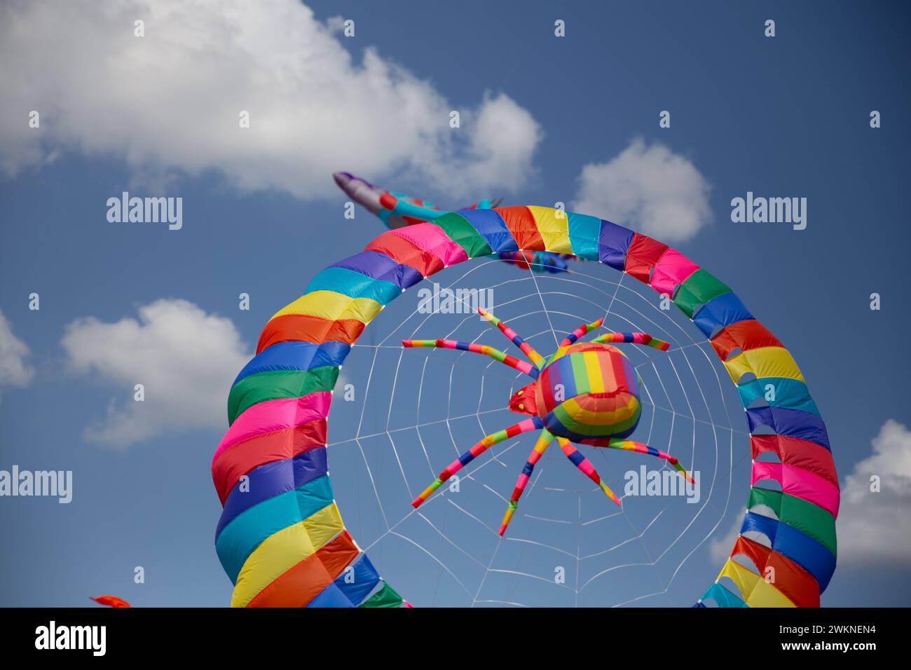 Rainbow colored Spider Kite Flying Stock Photo - Alamy