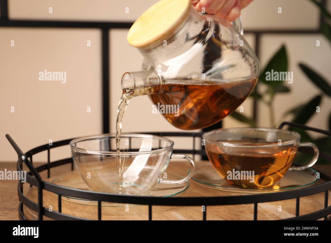 Woman pouring aromatic tea cup hi-res stock photography and images - Alamy