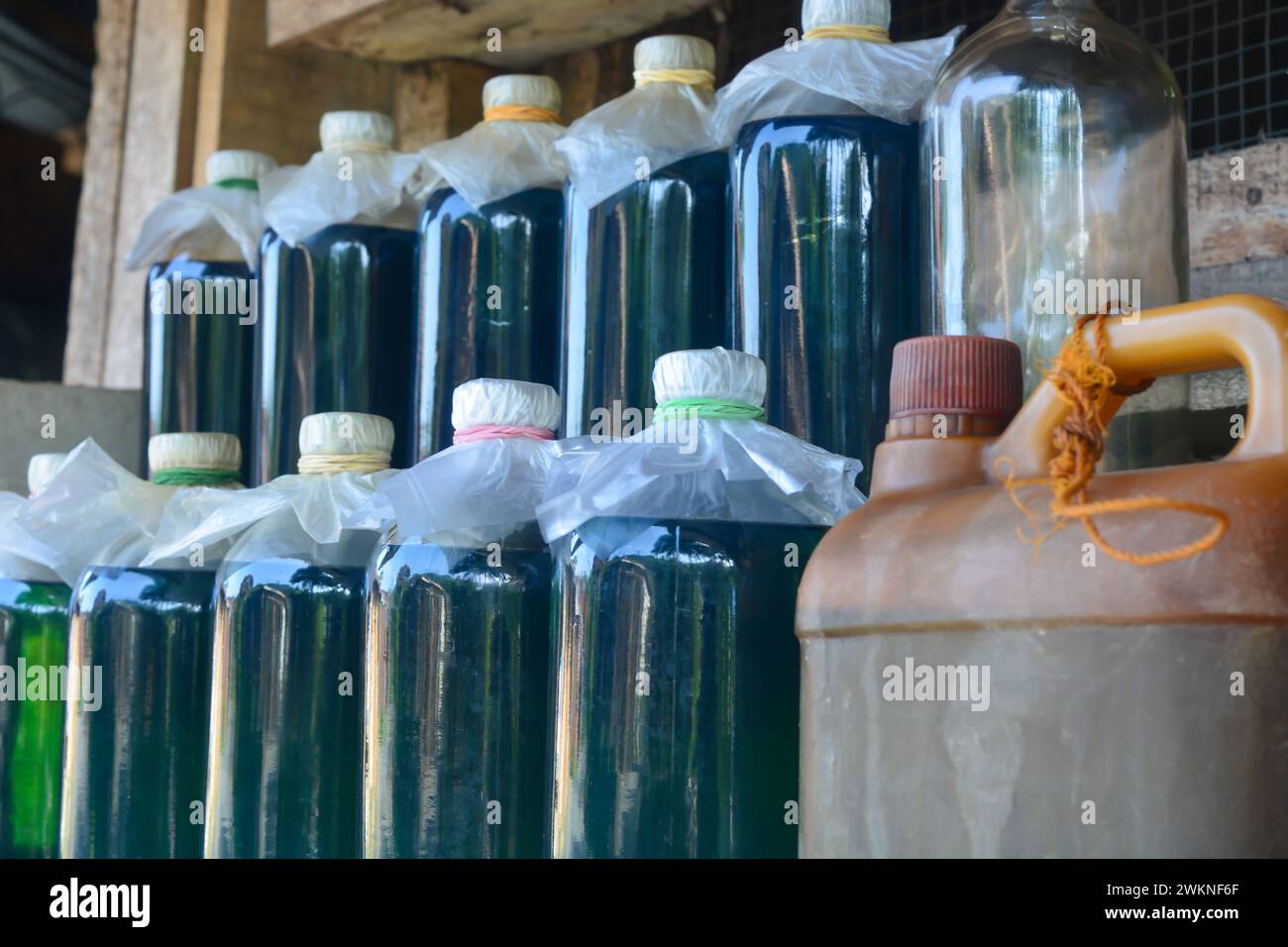 Gasoline sold in retail uses liter bottles Stock Photo - Alamy