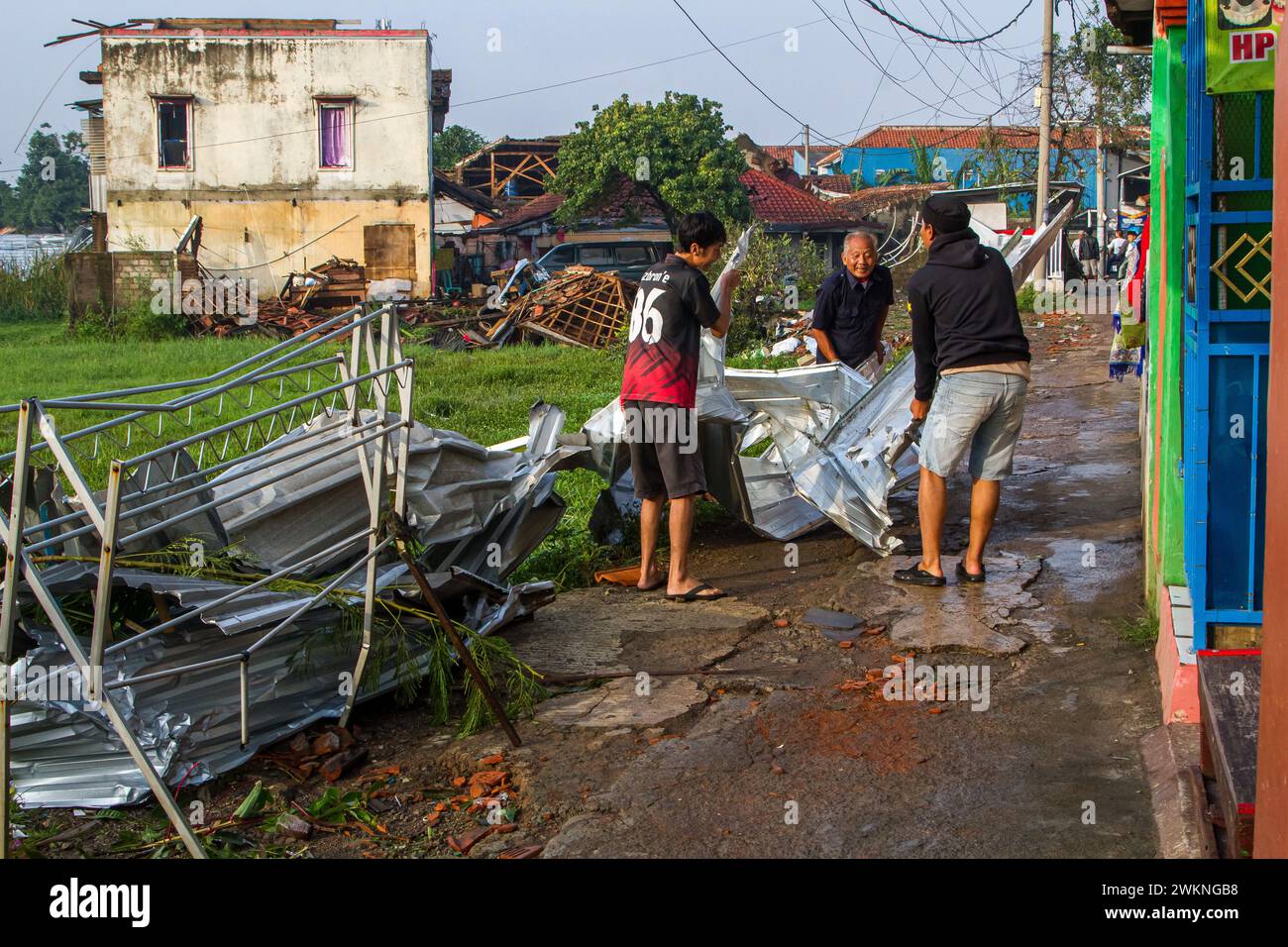 Sumedang Regency, West Java, Indonesia. 22nd Feb, 2024. Residents repair houses and buildings ...