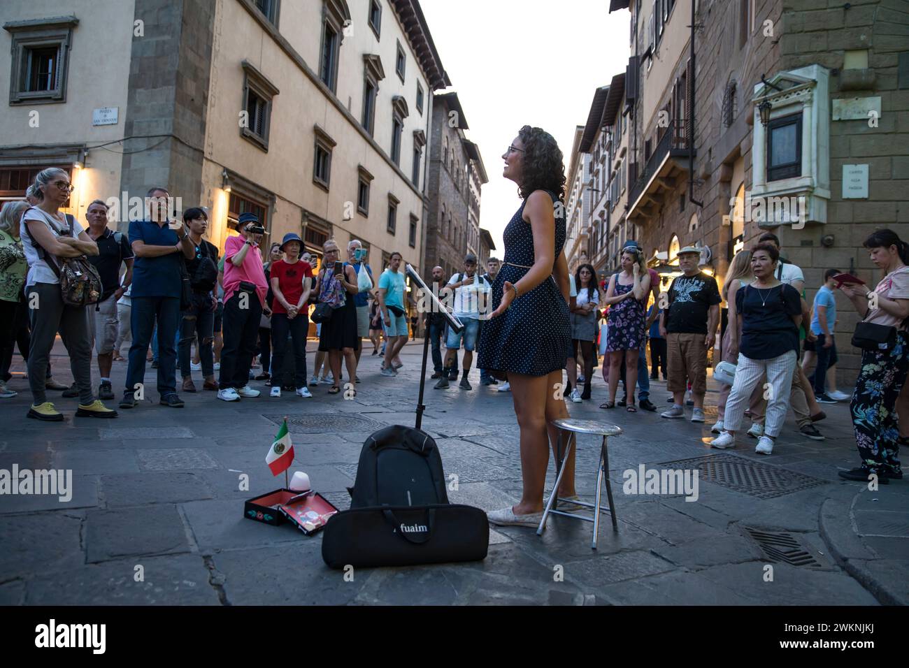 A young opera singer performs for tips in the Piazza del Duomo in ...