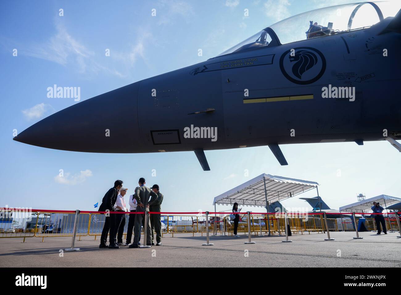 Visitors stand next to Singaporean Air Force's F15SG fighter jet on ...