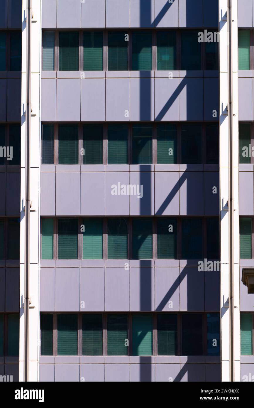 Abstract apartment building exterior view showing glass windows and ...
