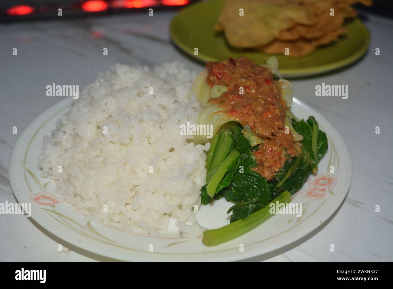 A plate of pecel rice, on a white background Stock Photo - Alamy