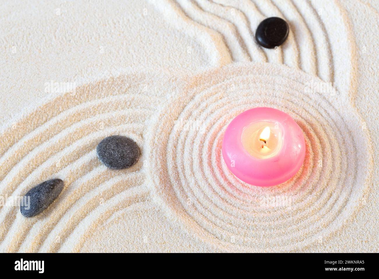 Zen garden with the sand, stones and the burning candle Stock Photo - Alamy