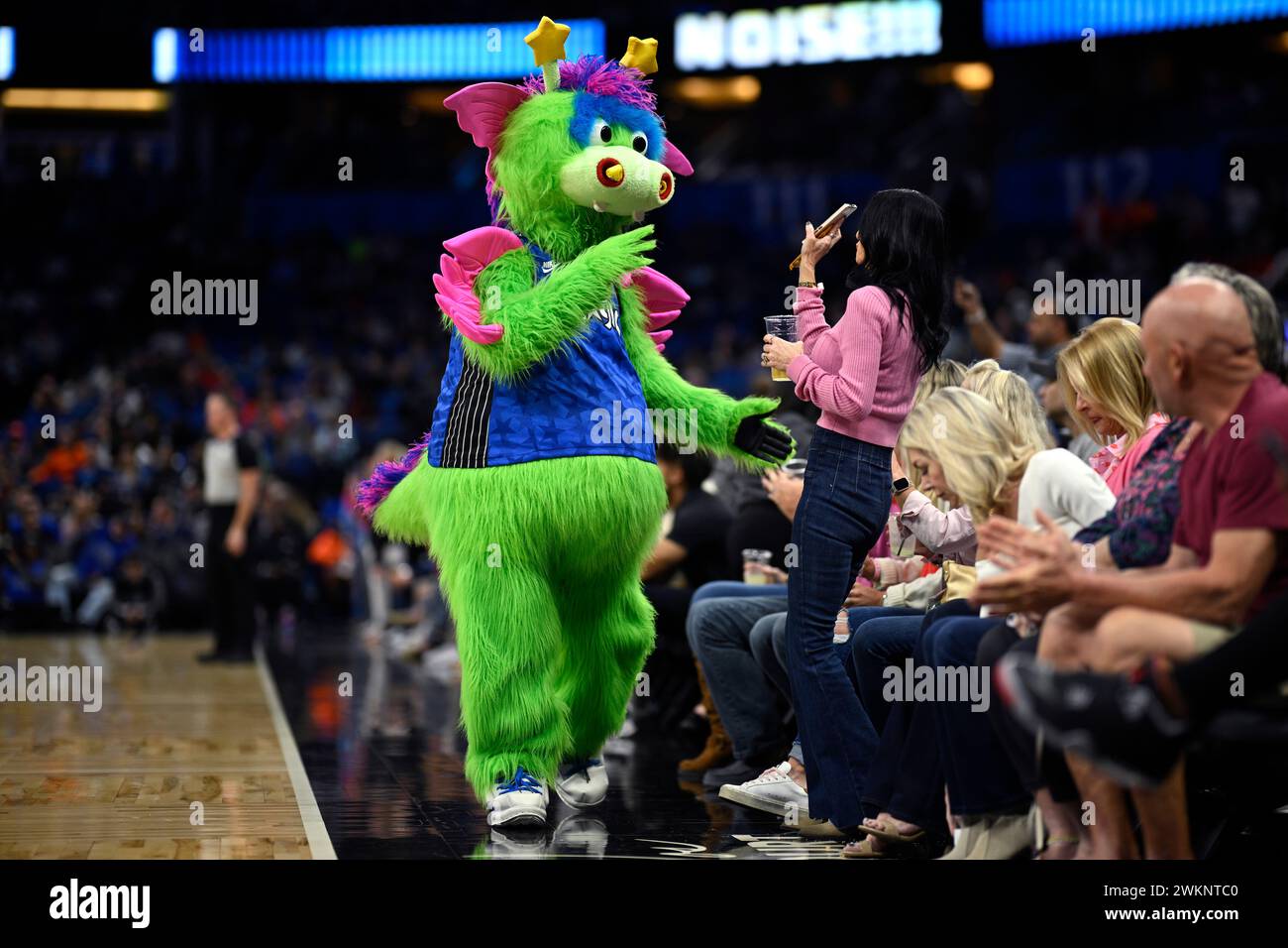 Orlando Magic mascot Stuff interacts with a spectator sitting court ...