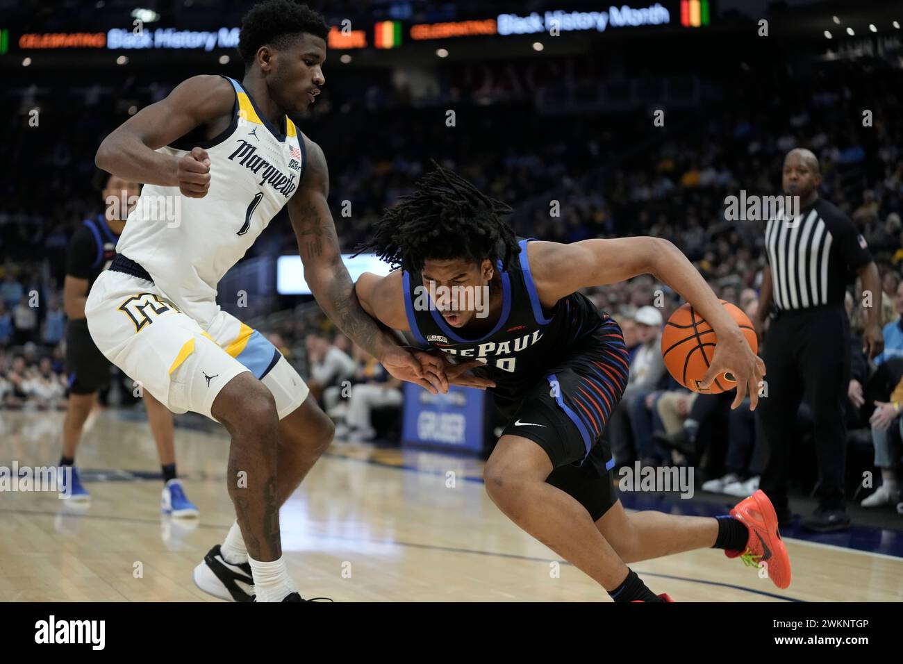 Marquette's Kam Jones knocks the ball from DePaul's Jaden Henley during ...