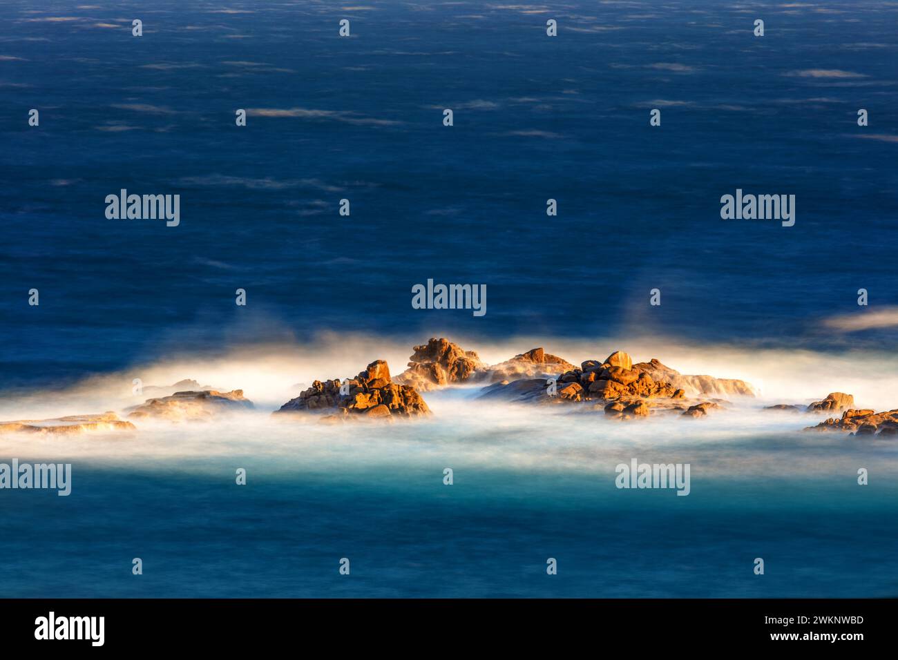 The sea washes around an offshore reef, long exposure, La Crucecita ...