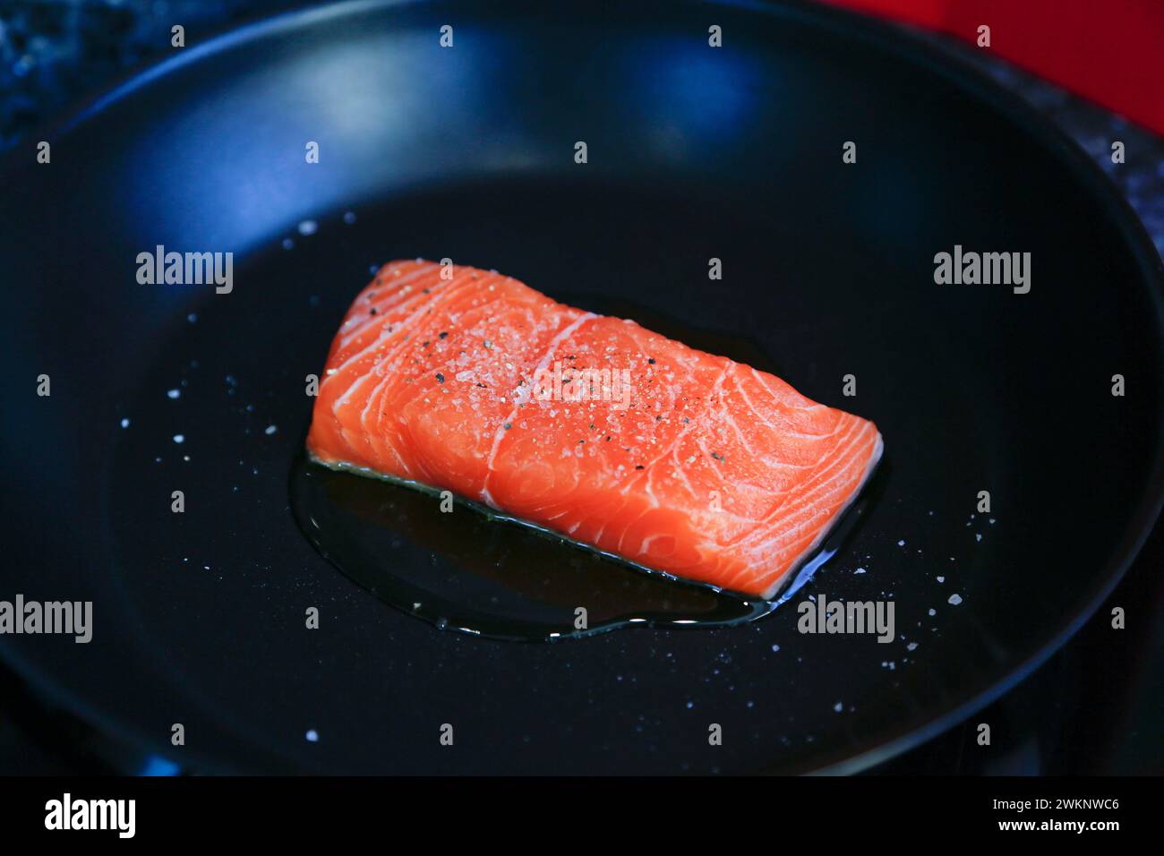 Preparation of Dreisam salmon with wild rice, raw salmon fillet in a ...
