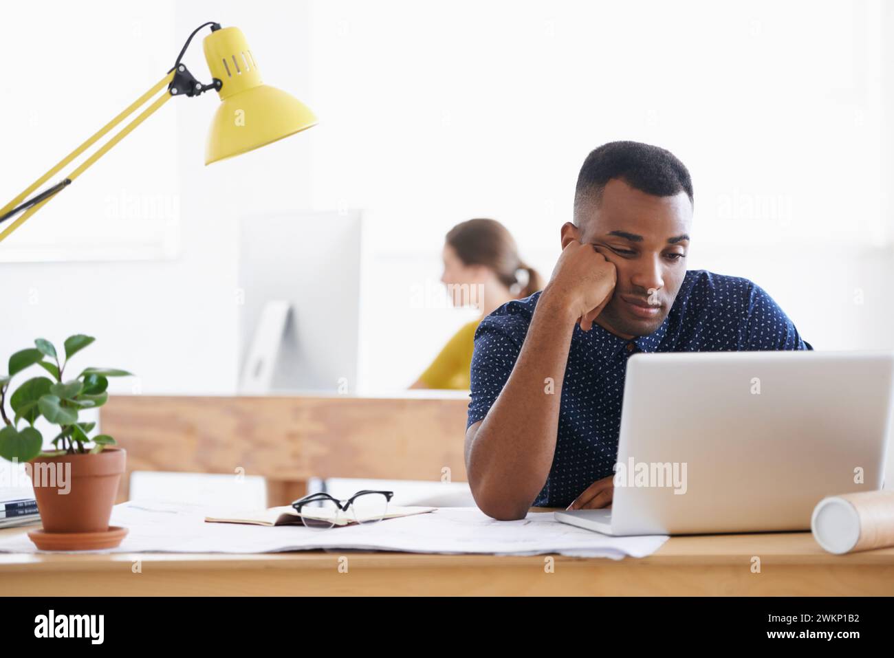 African architect, depressed and tired from failed project, upset and ...